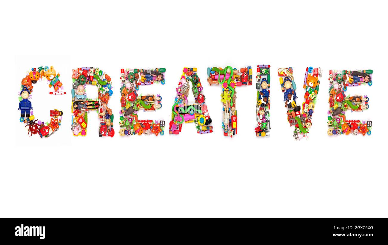 the word Creative with lots of small toys Stock Photo - Alamy