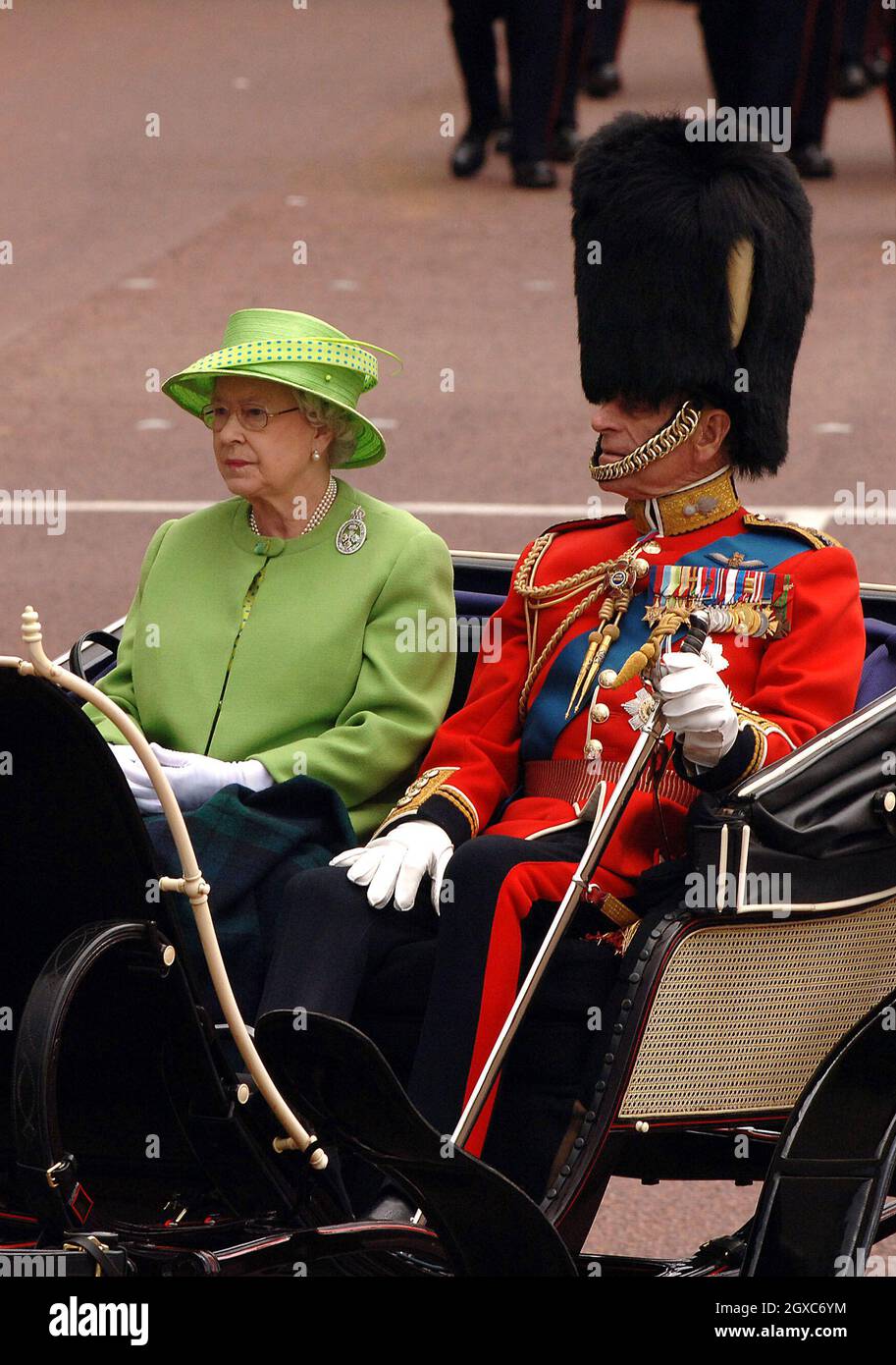 Queen Elizabeth ll and Prince Philip, Duke of Edinburgh sit in an open ...