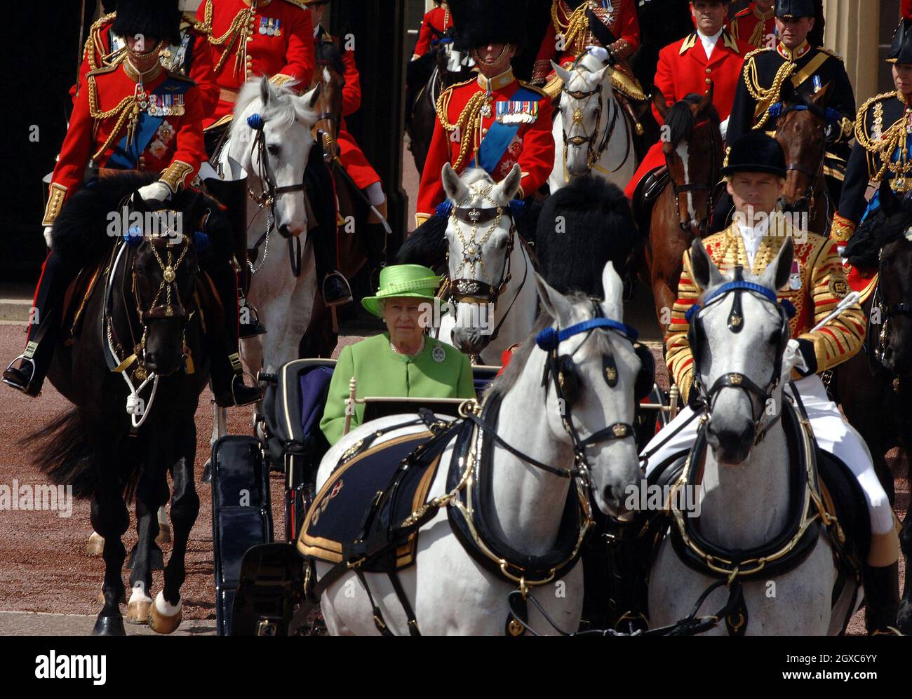 Queen Elizabeth ll and Prince Philip, Duke of Edinburgh sit in an open ...