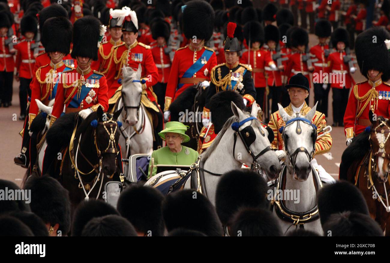 Queen Elizabeth ll and Prince Philip, Duke of Edinburgh sit in an open ...