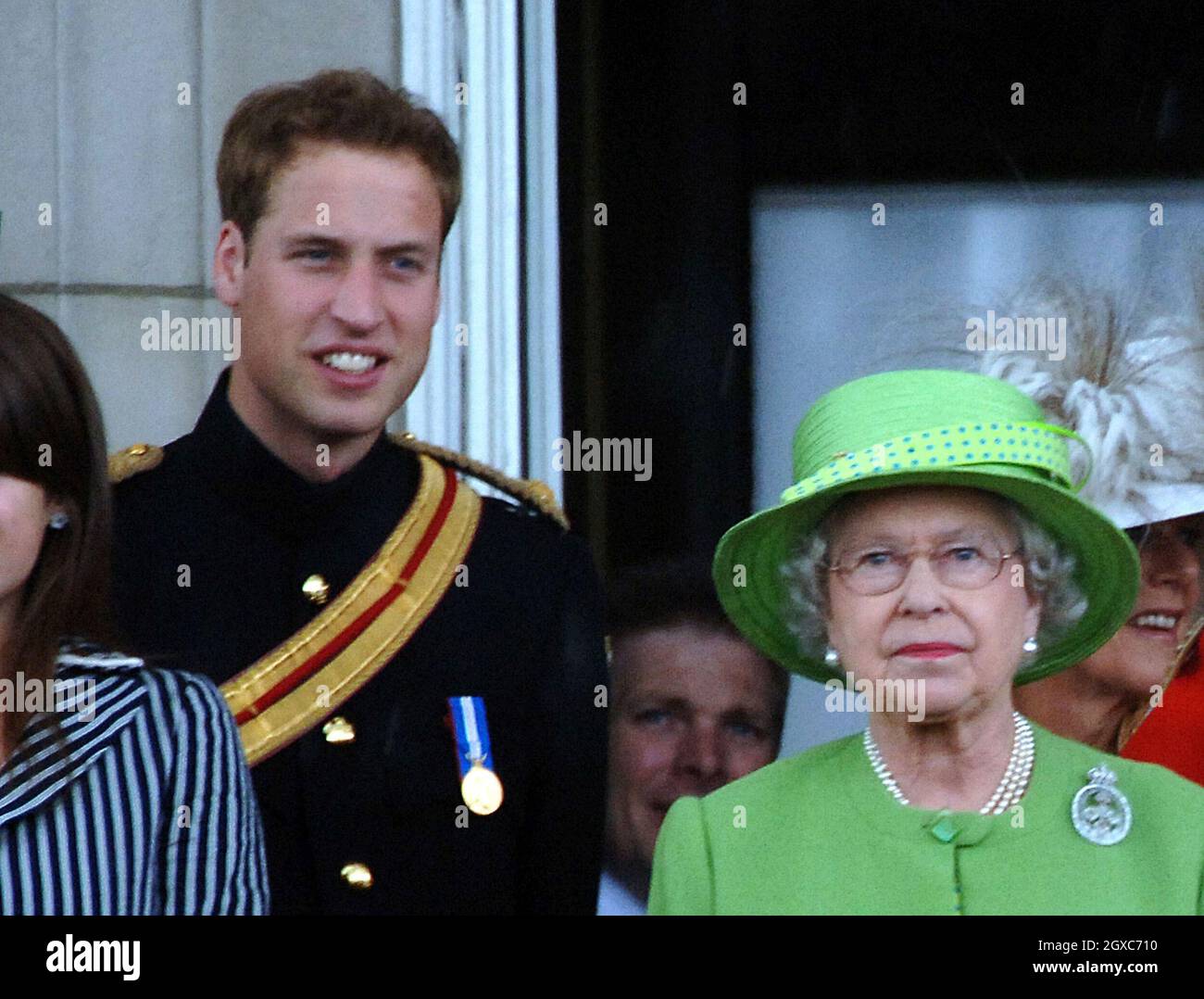 Prince William and Queen Elizabeth ll stand on the balcony of ...