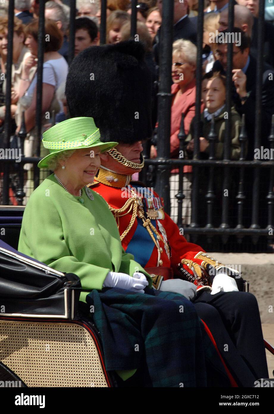 Queen Elizabeth ll and Prince Philip, Duke of Edinburgh sit in an open ...