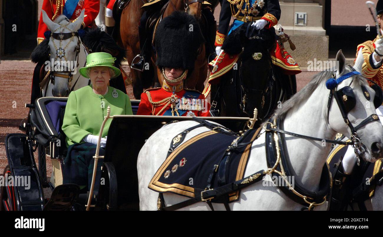 Queen Elizabeth ll and Prince Philip, Duke of Edinburgh sit in an open ...