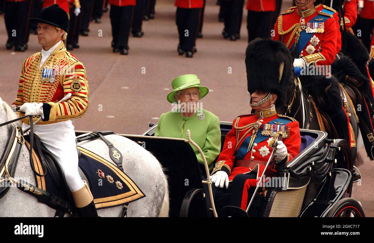 Queen Elizabeth ll and Prince Philip, Duke of Edinburgh sit in an open ...