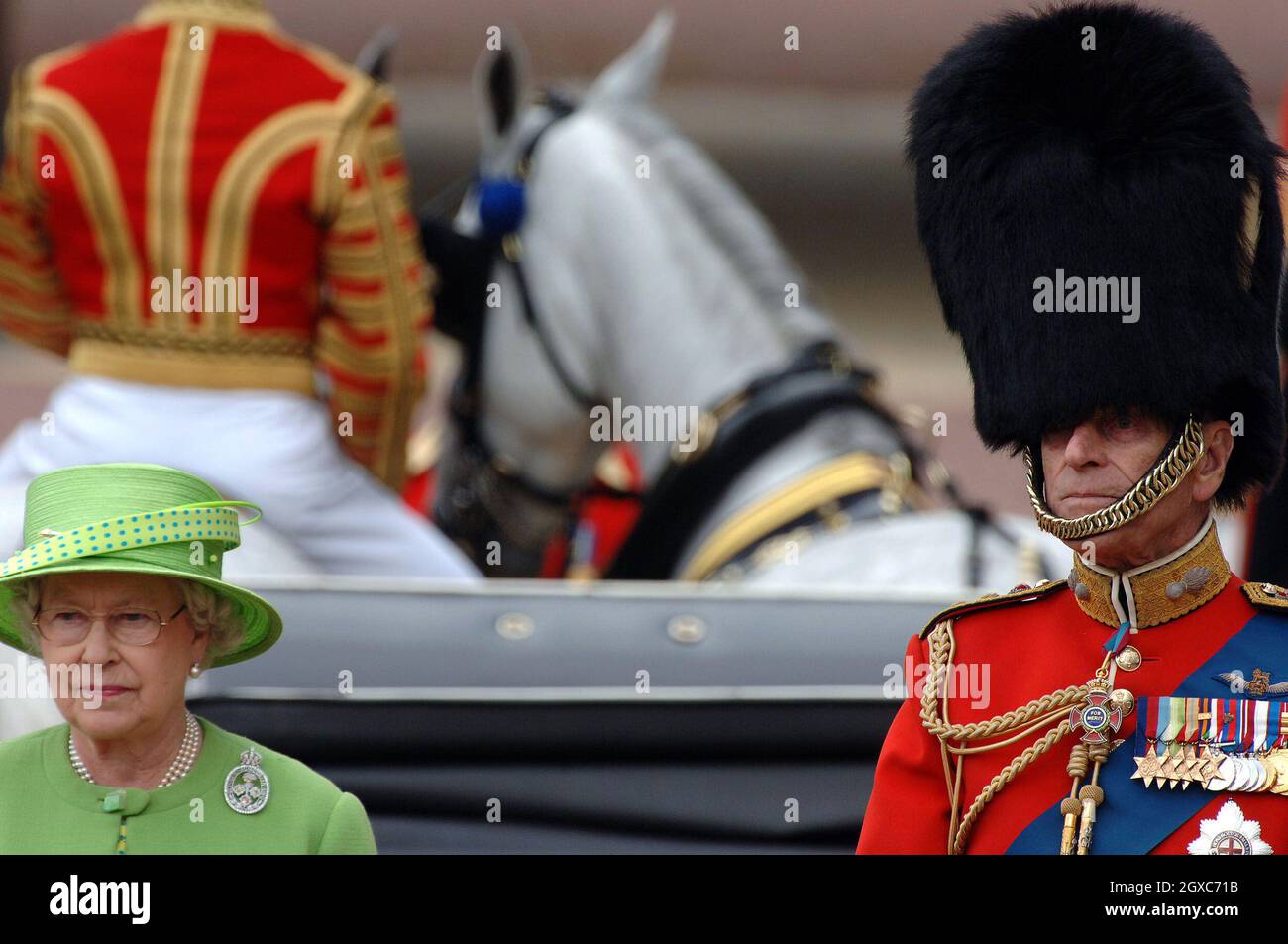 Queen Elizabeth ll and Prince Philip, Duke of Edinburgh sit in an open ...