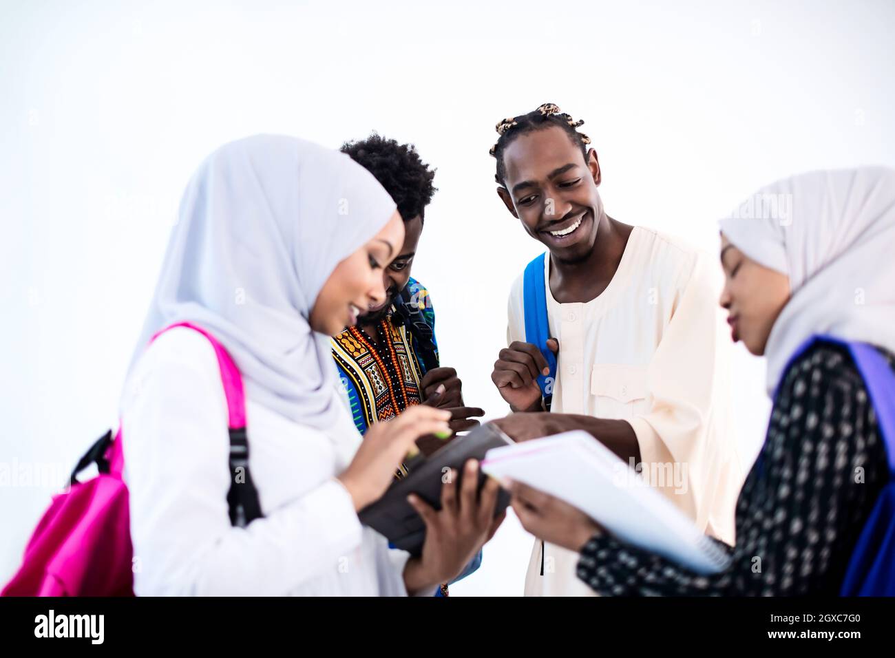 group of happy african students having conversation and team meeting ...