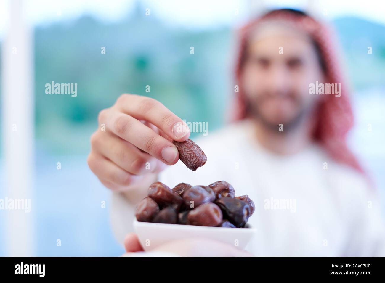 Eid Mubarak Muslim family having Iftar dinner eating dates to break ...