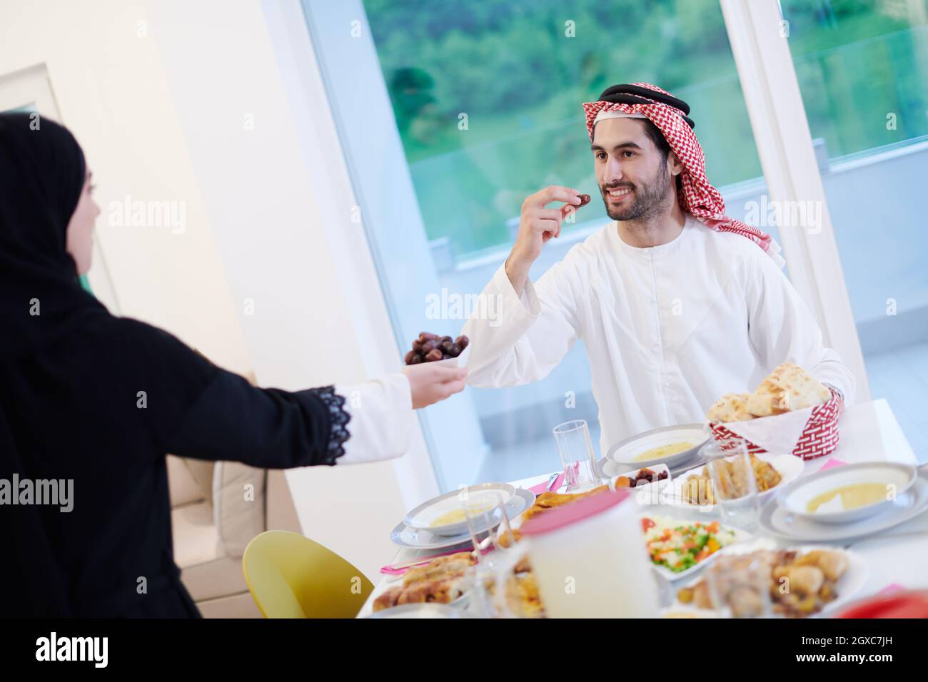 Eid Mubarak Muslim family having Iftar dinner eating dates to break ...