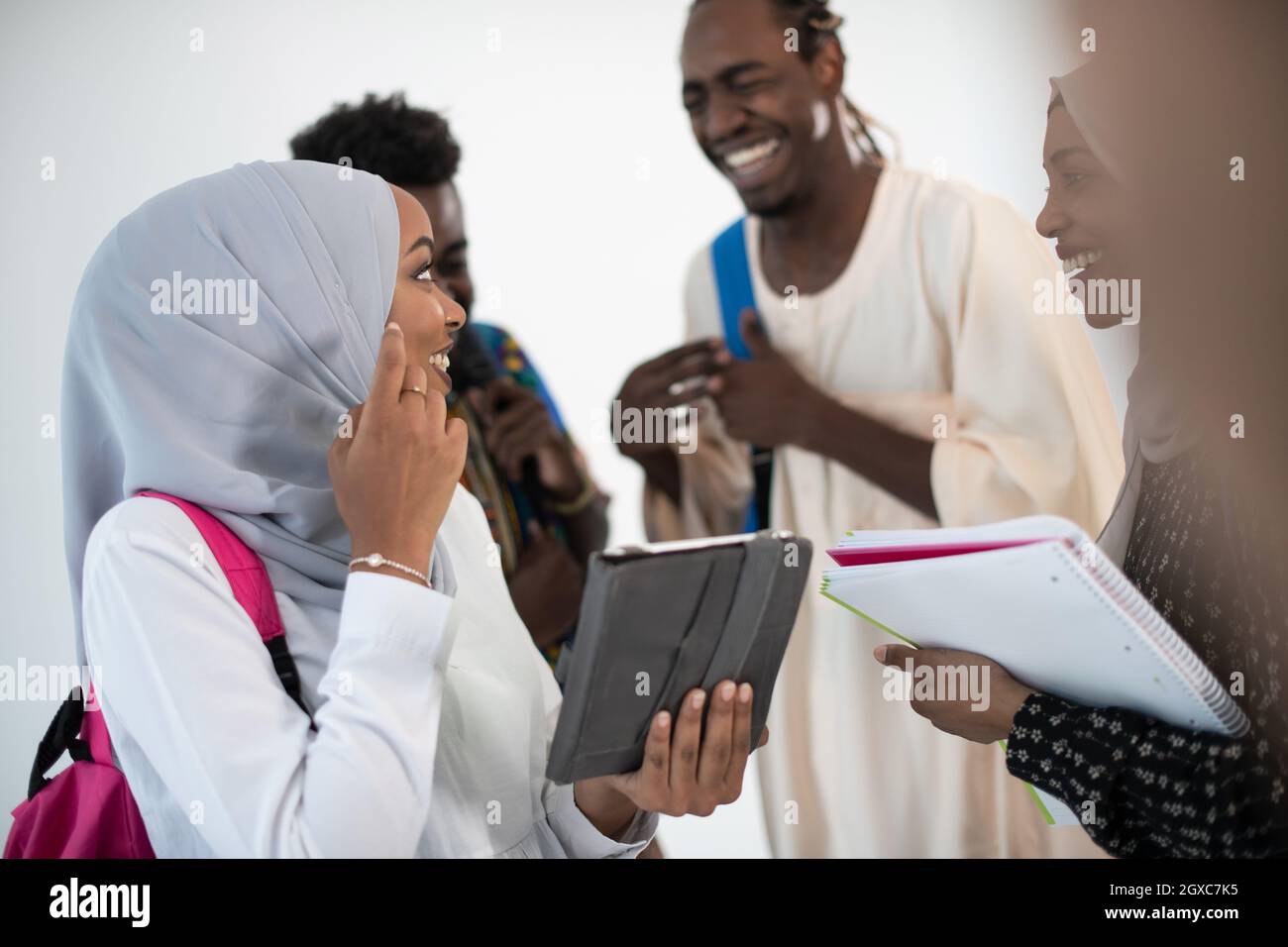 group of happy african students having conversation and team meeting ...