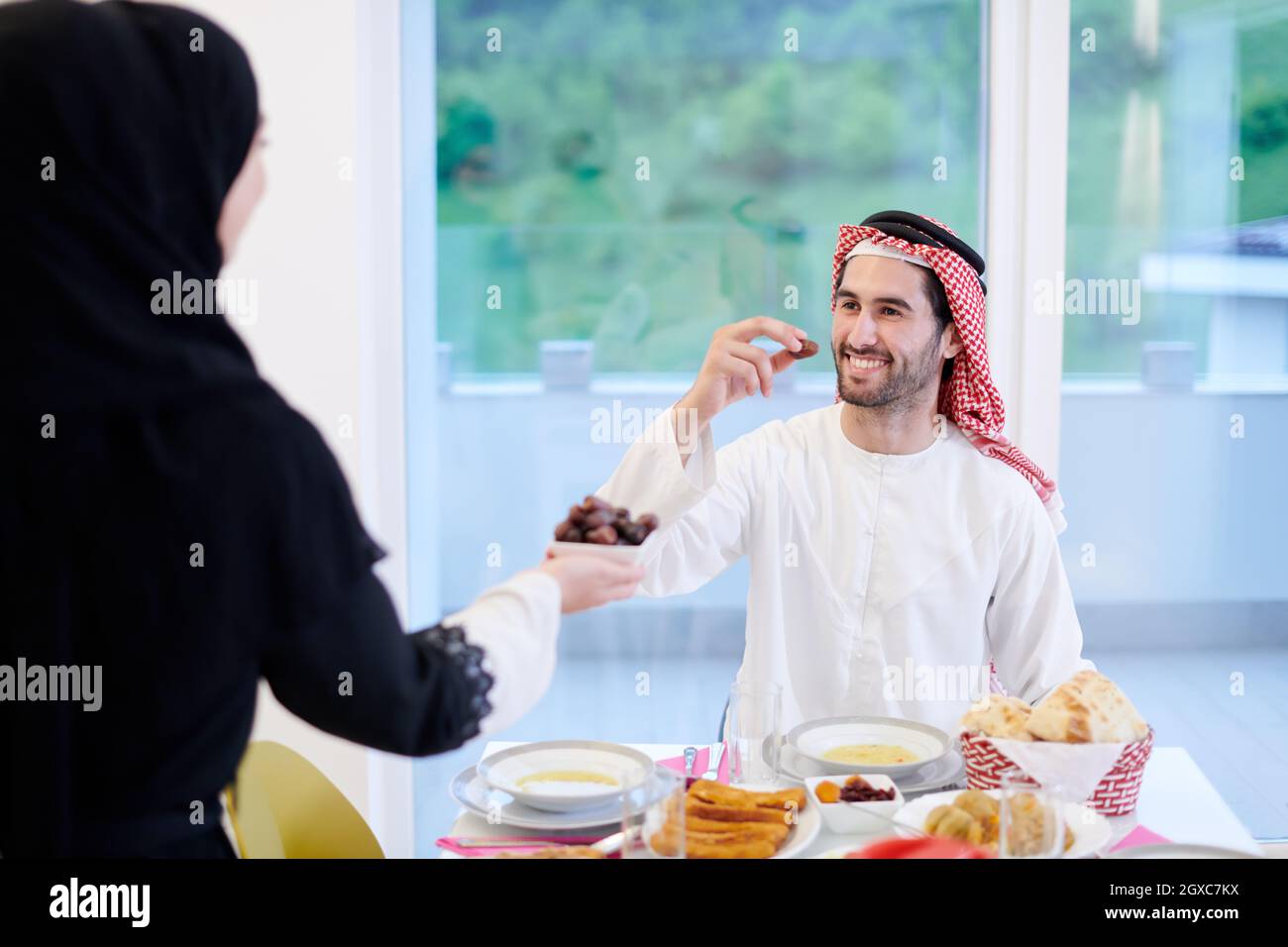 Eid Mubarak Muslim family having Iftar dinner eating dates to break ...