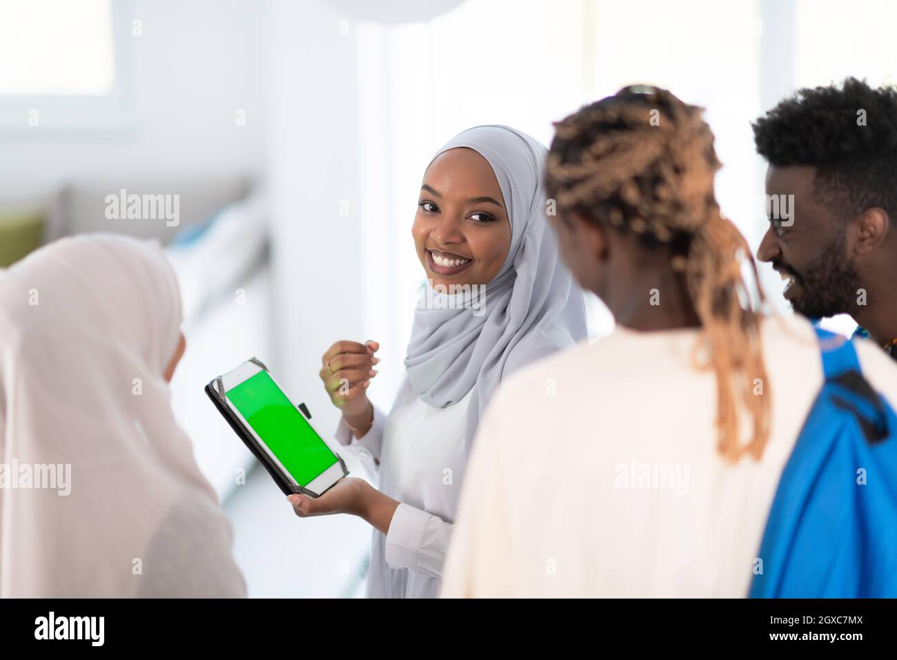 group of happy african students having conversation and team meeting ...