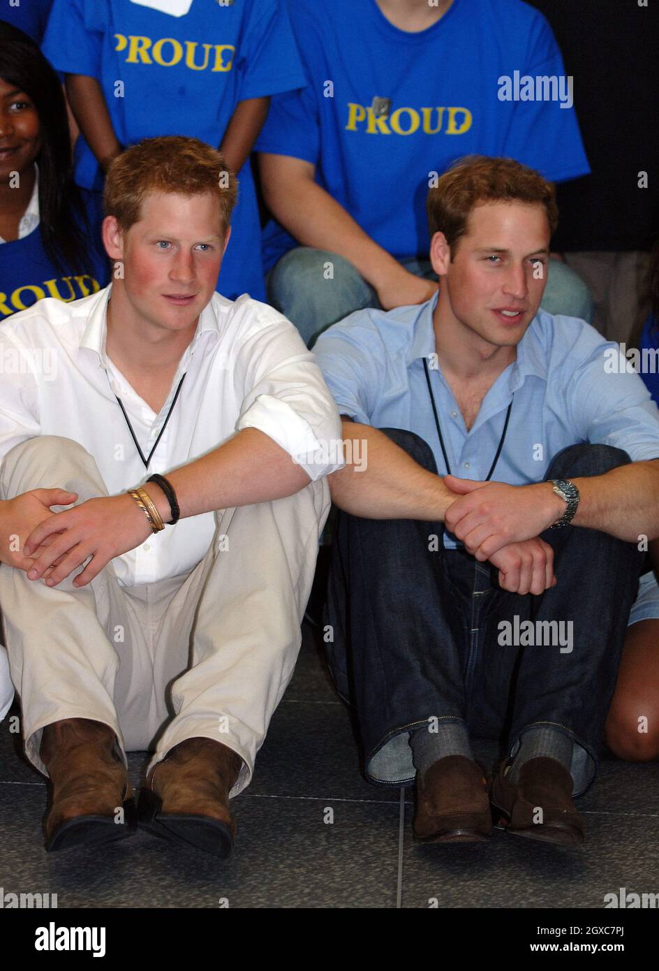 Prince William and Prince Harry sit and pose with children at a lunch ...