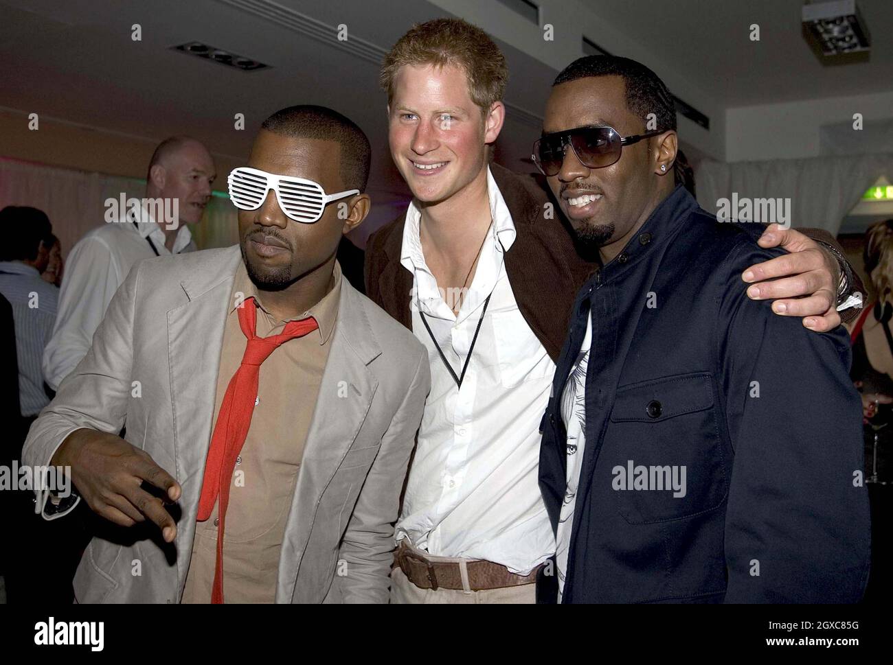Prince Harry meets rappers Kaye West and P Diddy (R) at a reception ...
