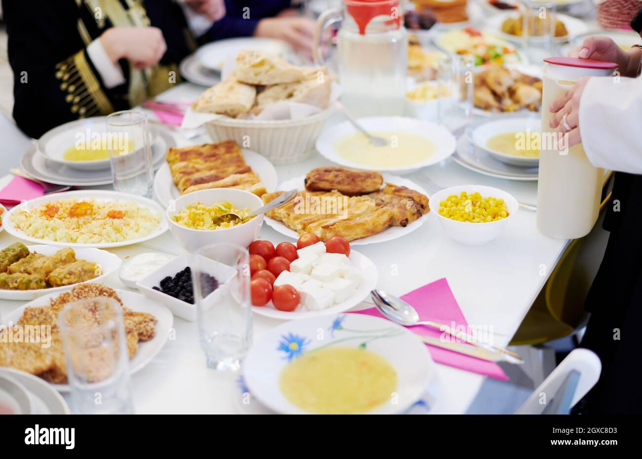 Eid Mubarak Muslim family having Iftar dinner Eating traditional food ...