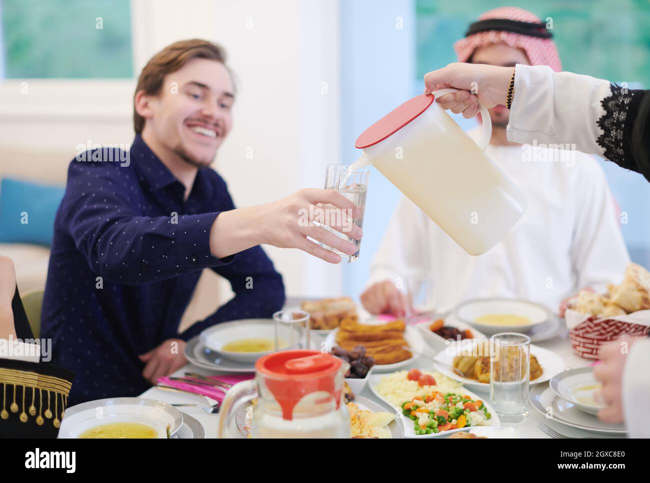 Eid Mubarak Muslim family having Iftar dinner drinking water to break ...