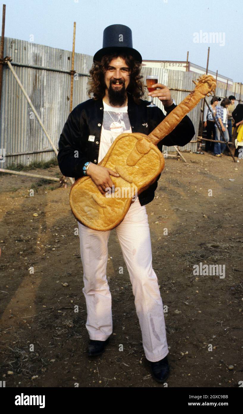 Scottish singer and comedian Billy Connolly holding a guitar made of ...