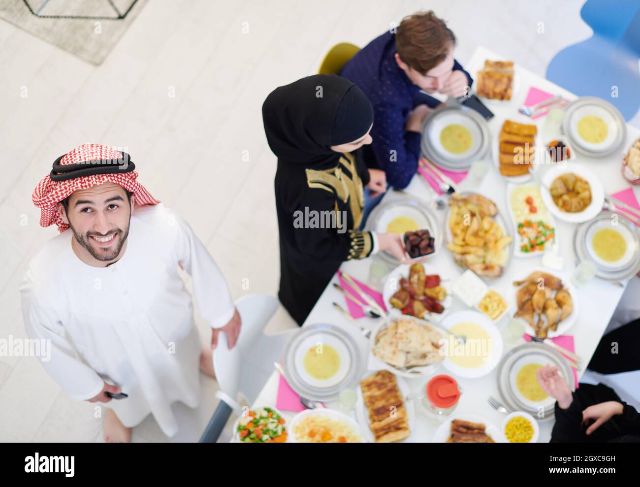 Eid Mubarak Muslim family having Iftar dinner Eating traditional food ...