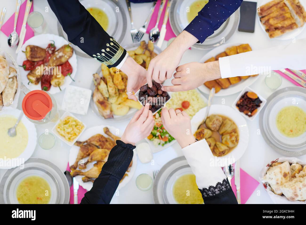 Eid Mubarak Muslim family having Iftar dinner eating dates to break ...