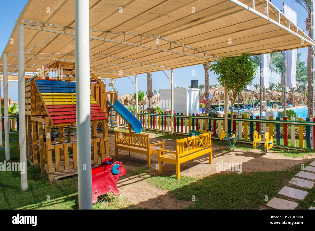 Large wooden climbing frame structure in children's playground area of ...
