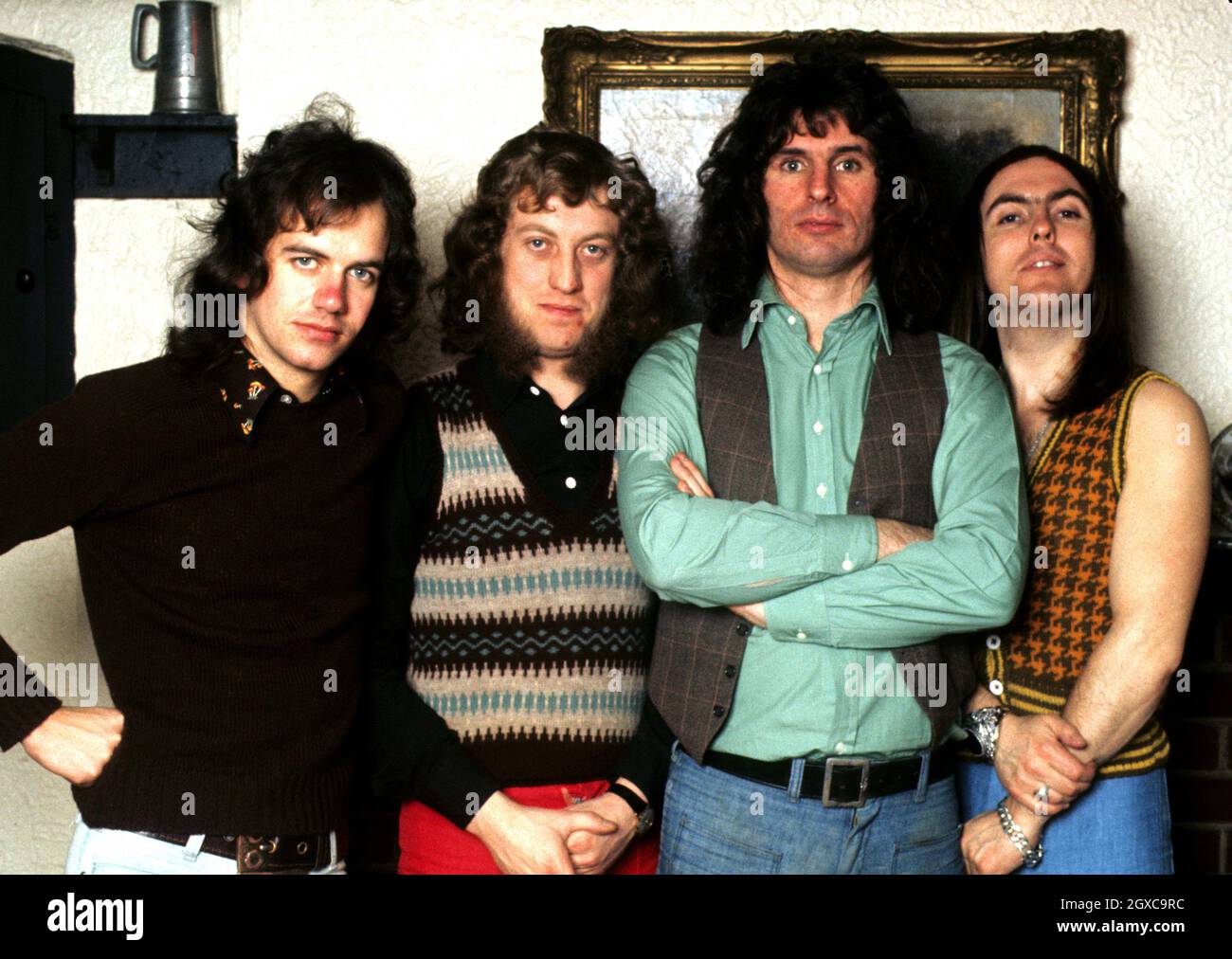The members of the glam rock group Slade, Noddy Holder (second left ...