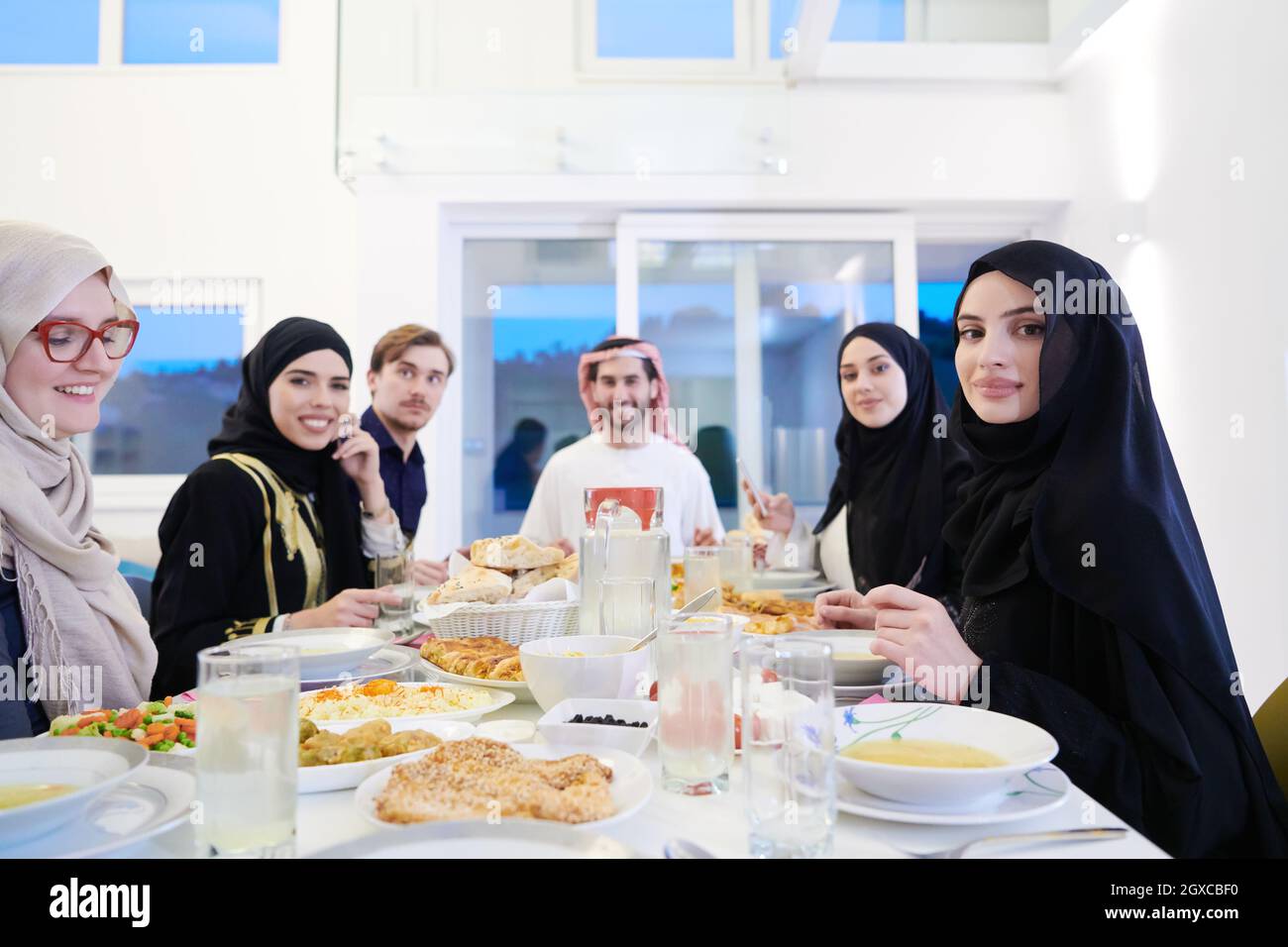 Eid Mubarak Muslim family having Iftar dinner Eating traditional food ...