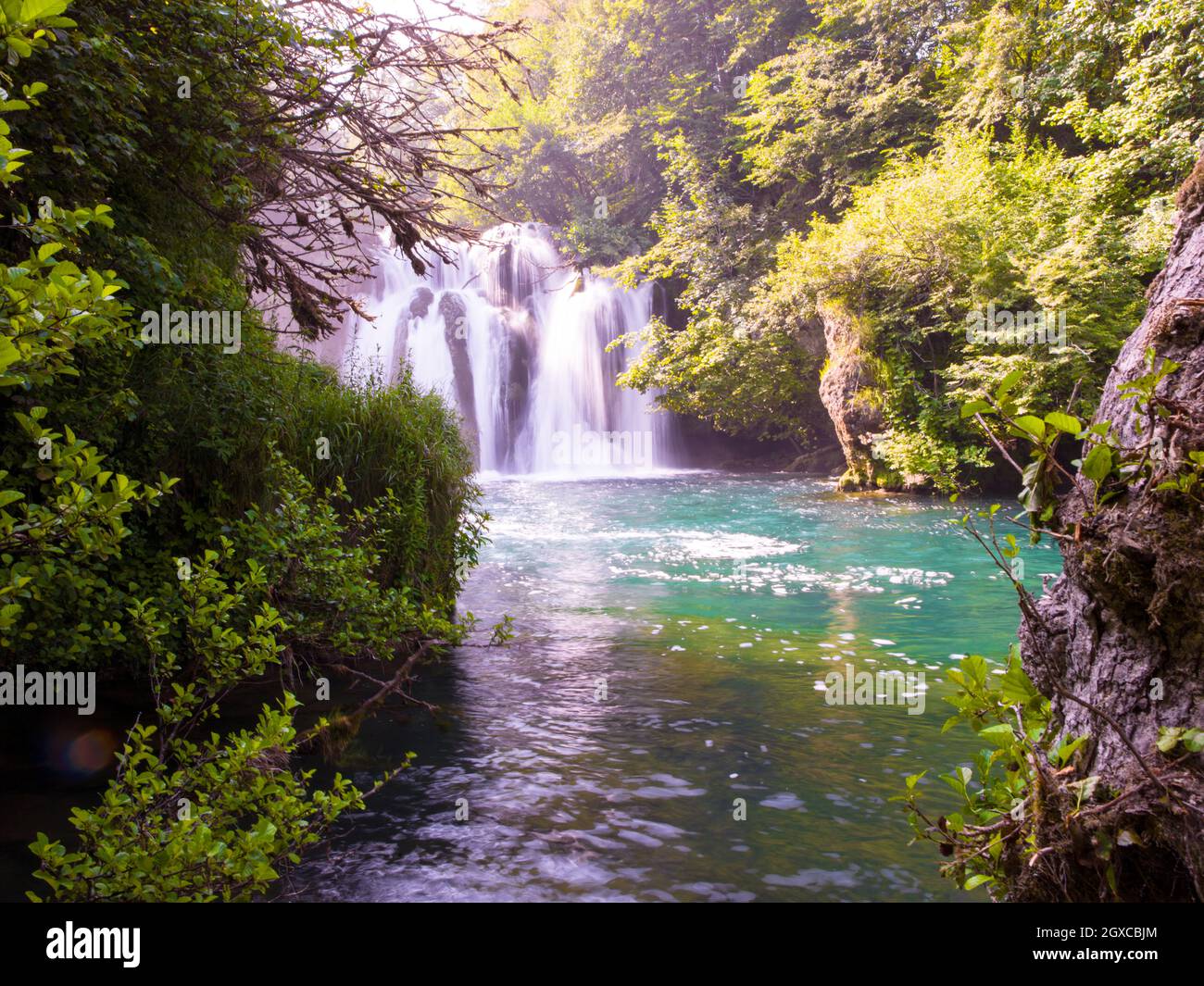 Amazing nature landscape, beautiful waterfall with sunlight in deep ...
