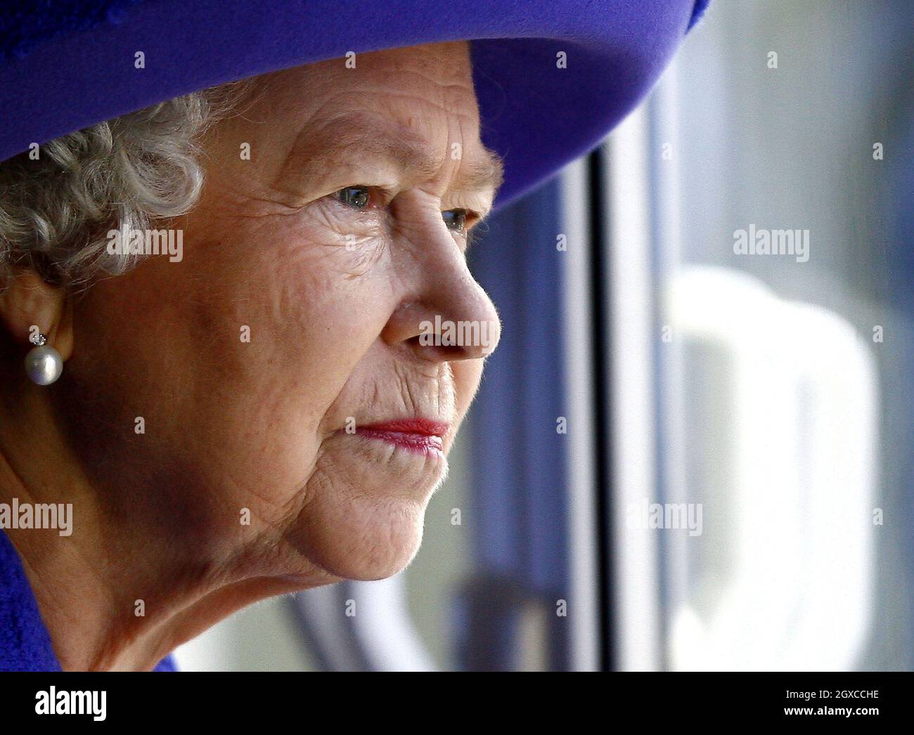 Queen Elizabeth II looks out from a window at the underwater stage at ...