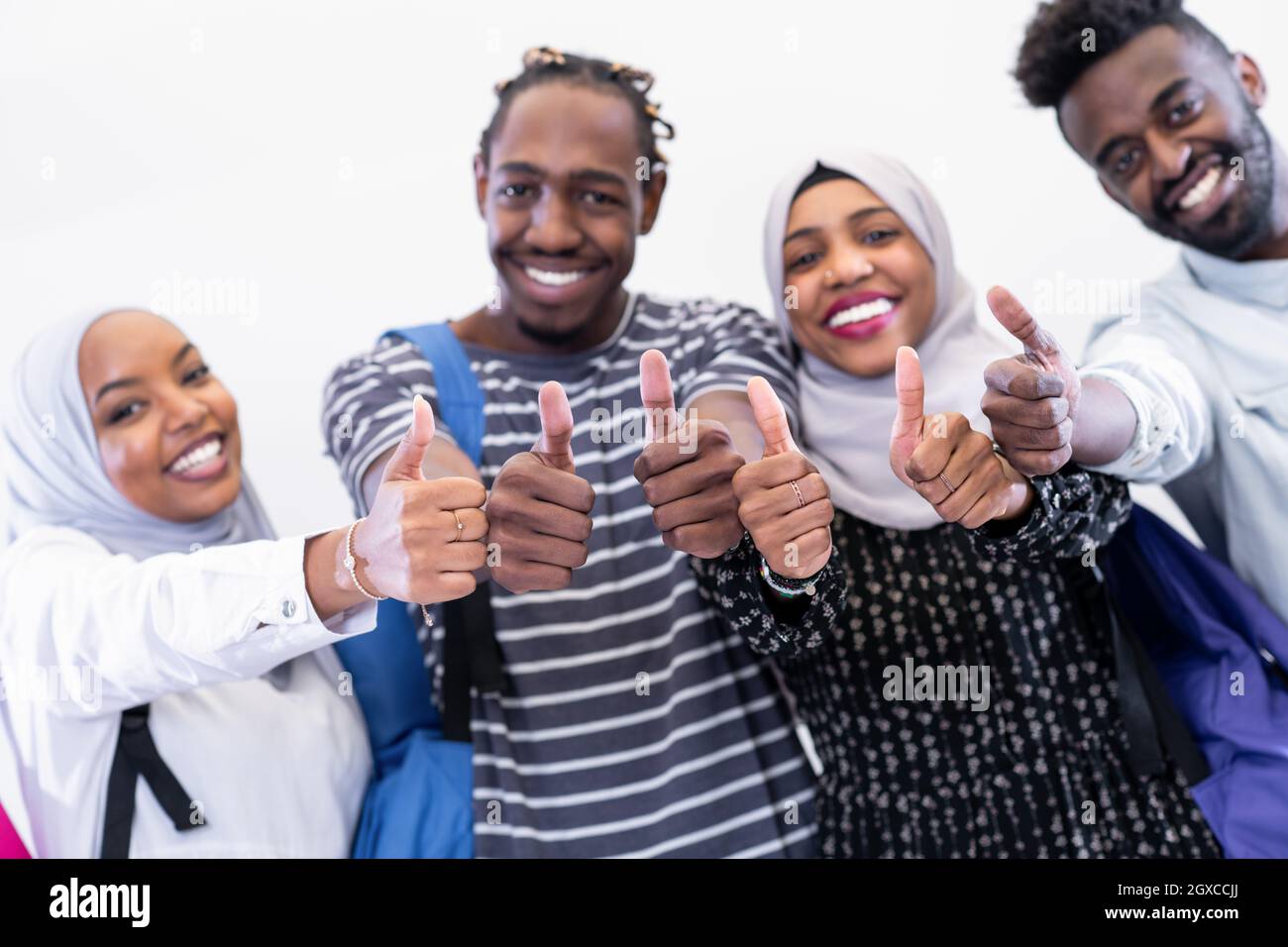 group portrait of happy african students standing together against ...