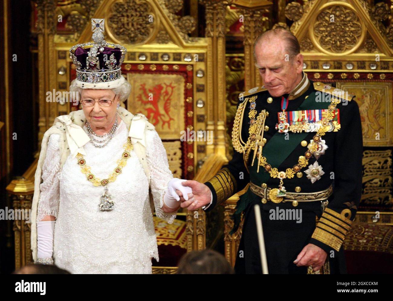 Queen Elizabeth II receives a helping hand from Prince Philip, Duke of ...