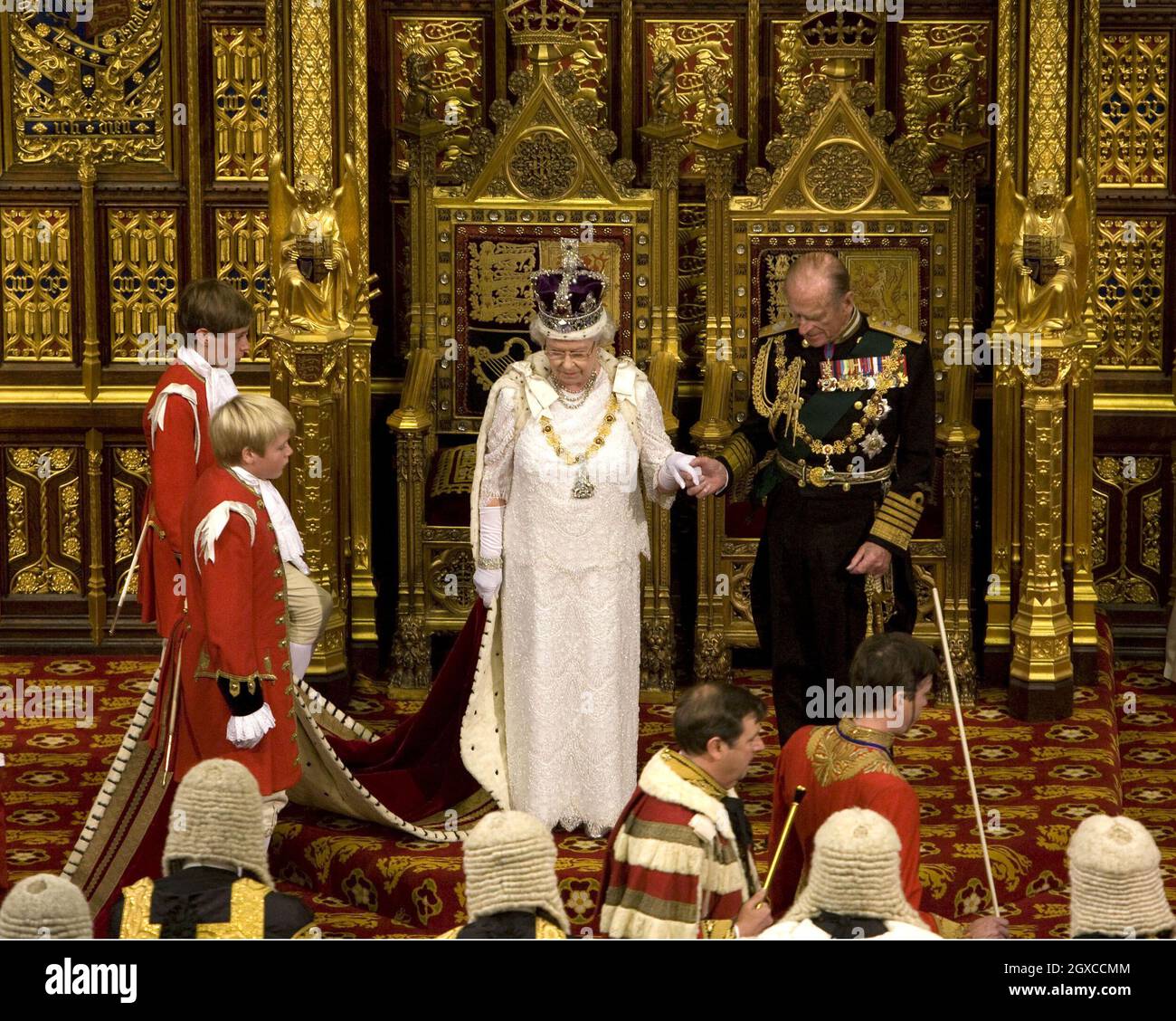 Queen Elizabeth II receives a helping hand from Prince Philip, Duke of ...