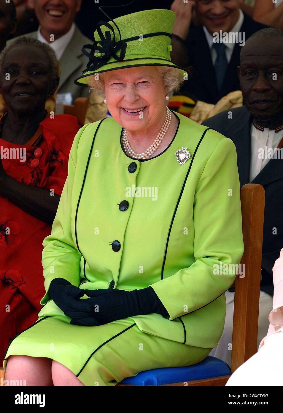 Queen Elizabeth ll watches orphans perform a fashion show at the ...