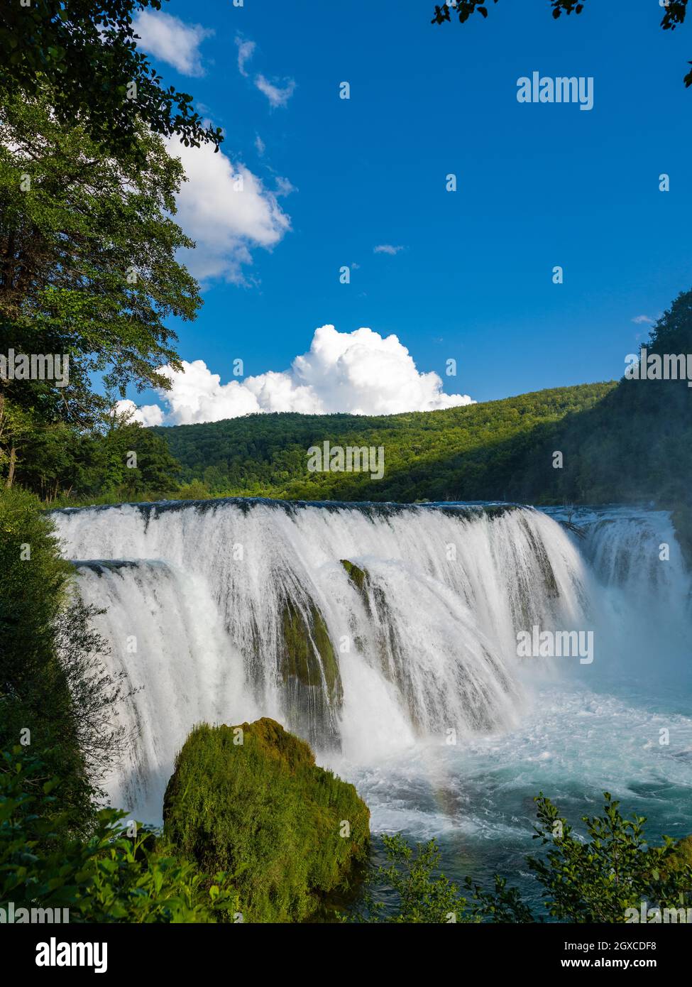 waterfall in beautiful nature with crystal clear water on wild river ...