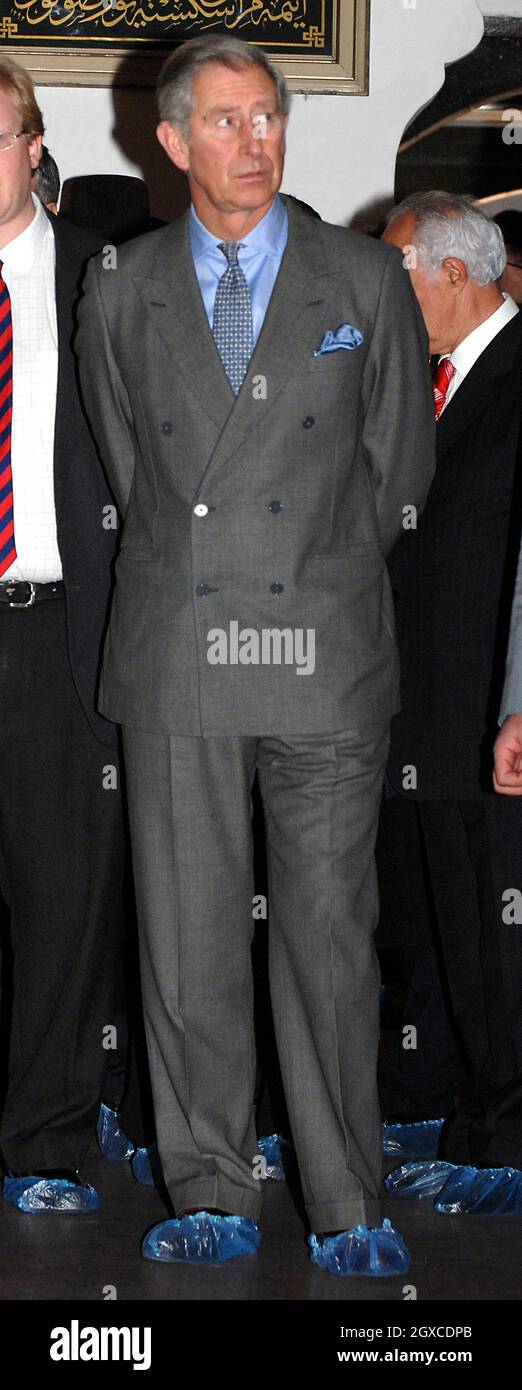 Prince Charles, Prince of Wales wears blue shoe covers as he visits the ...