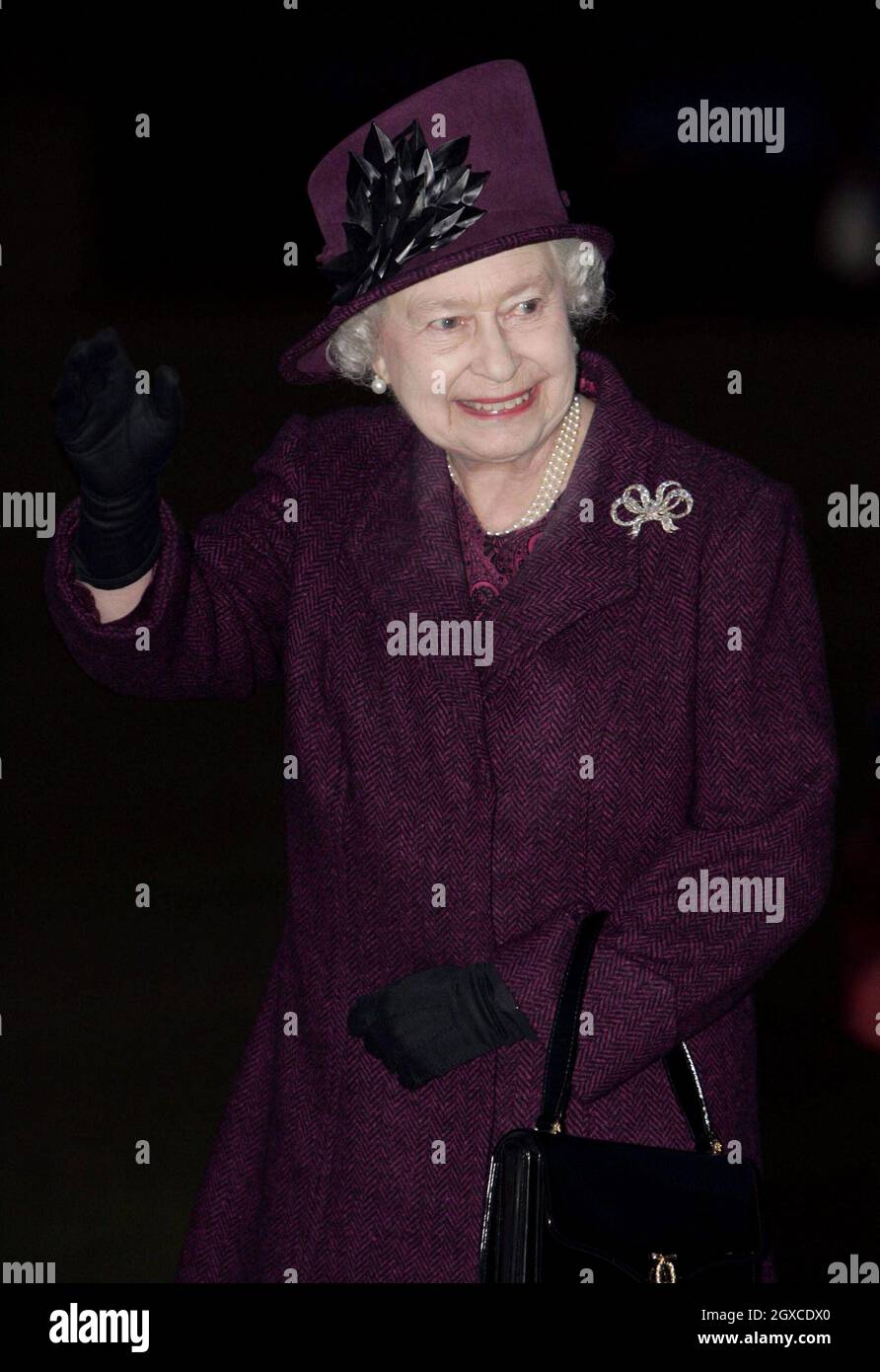 Queen Elizabeth II waves goodbye as she leaves Stowe School in Milton Keynes, Buckinghamshire ...