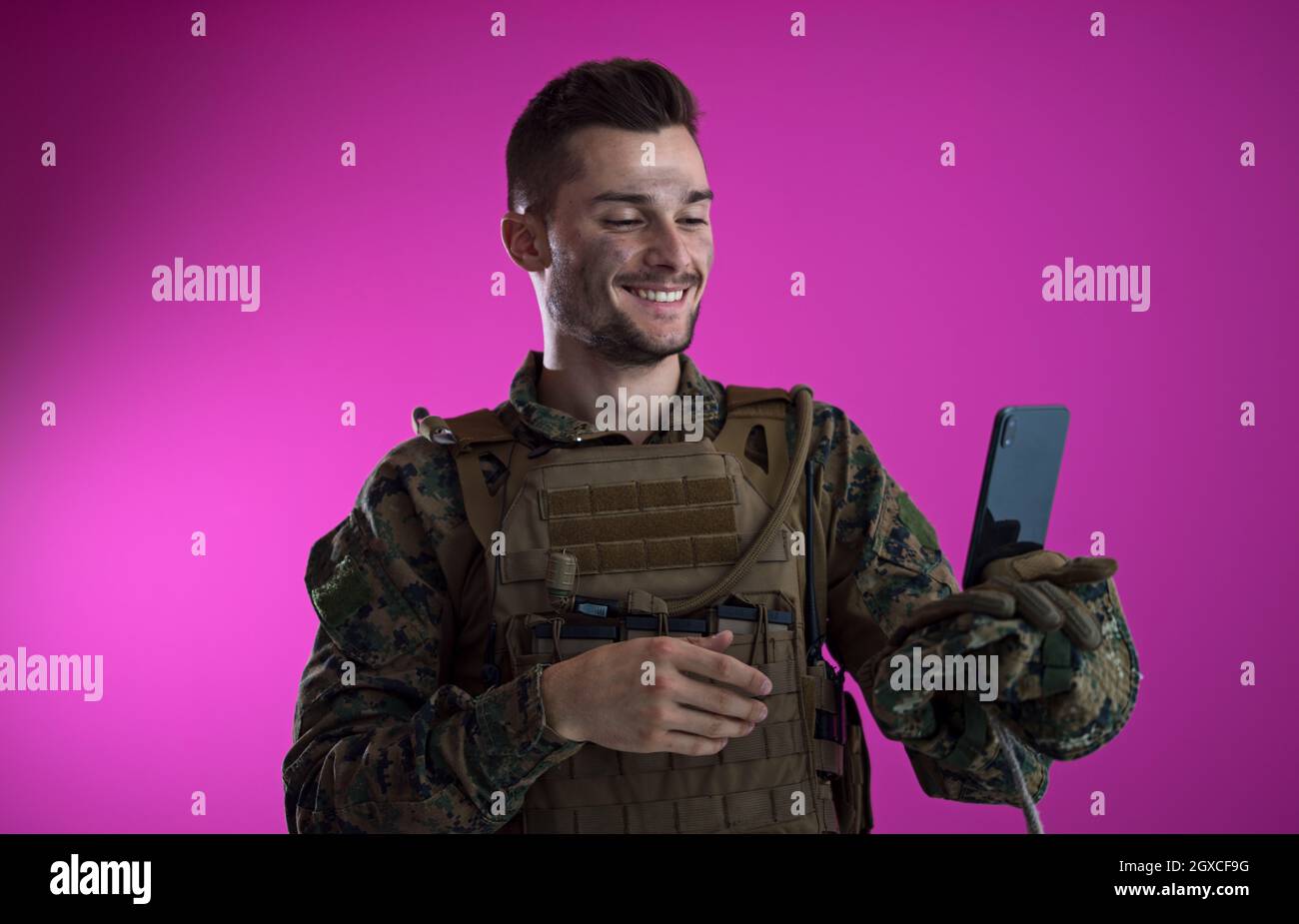 army soldier using smartphone to contact family or girlfriend ...