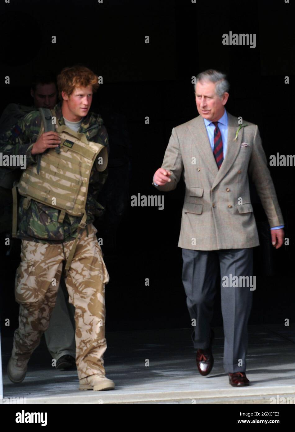 Prince Harry leaves the terminal at RAF Brize Norton with his father ...