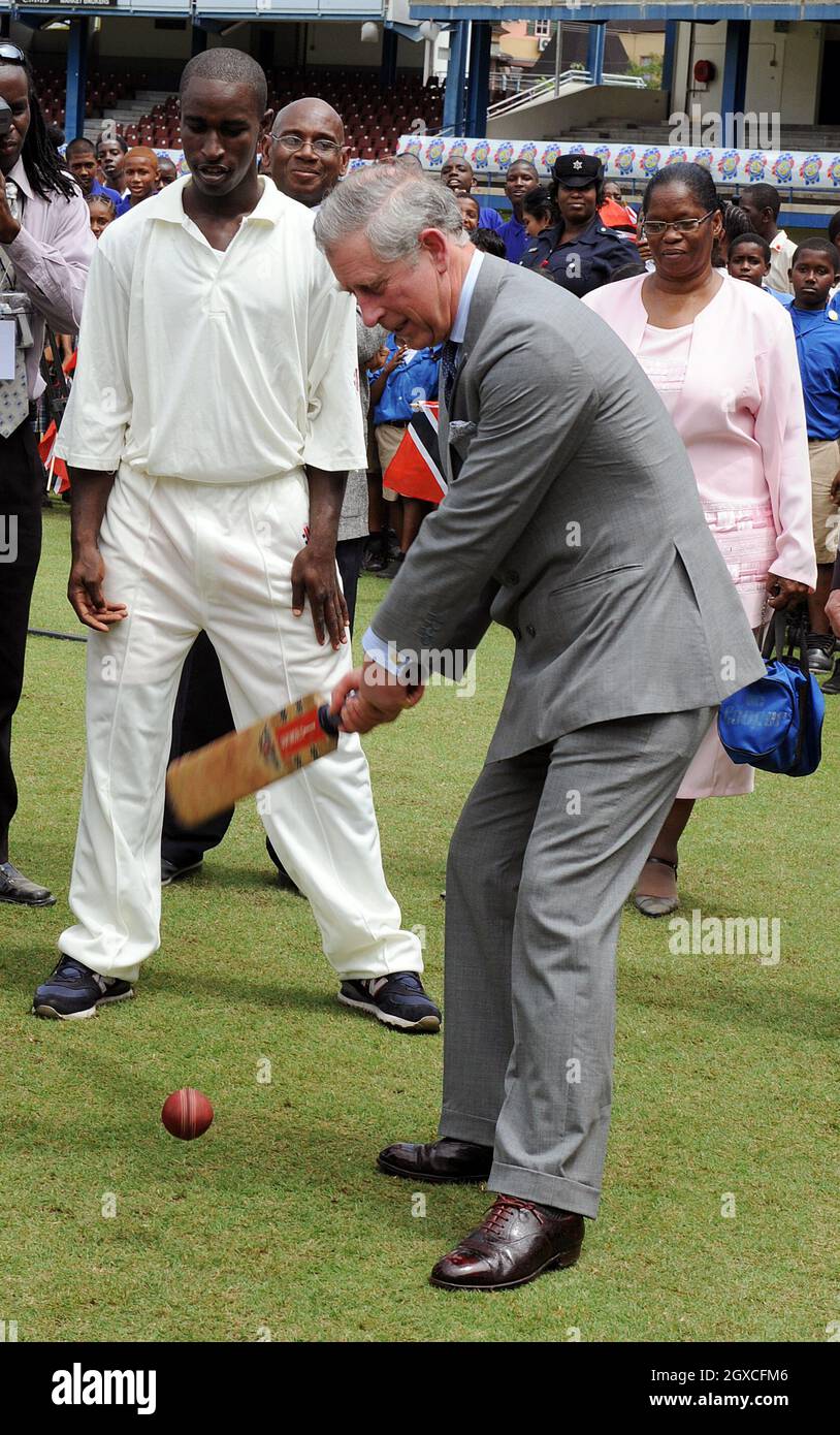 The Prince of Wales tries his hand with a cricket bat on a visit to the ...