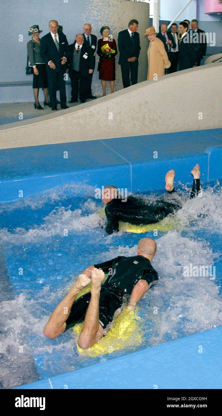 Queen Elizabeth II and Prince Philip, Duke of Edinburgh look on as ...
