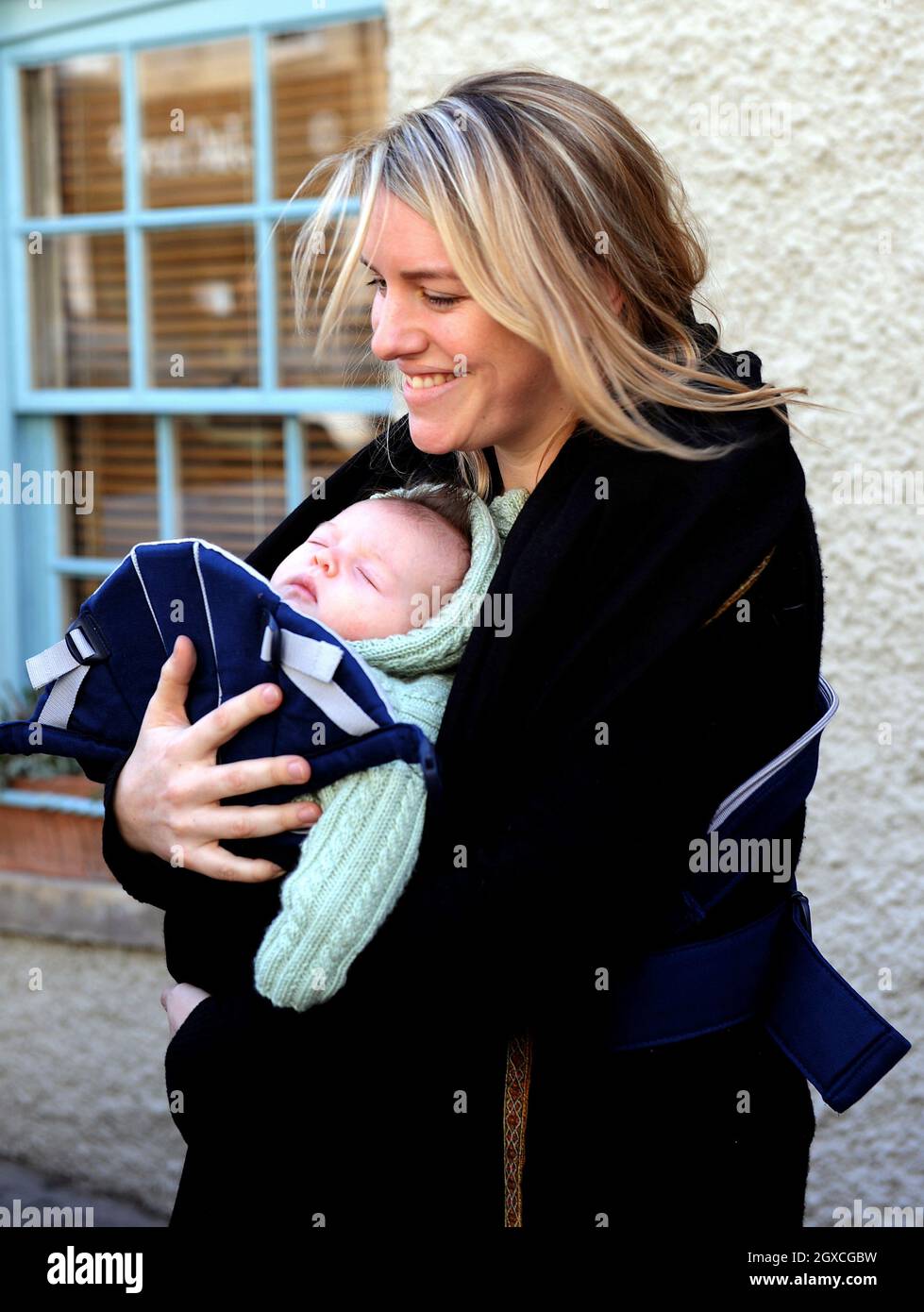 Laura Lopes and her baby daughter attend the opening of the new ...