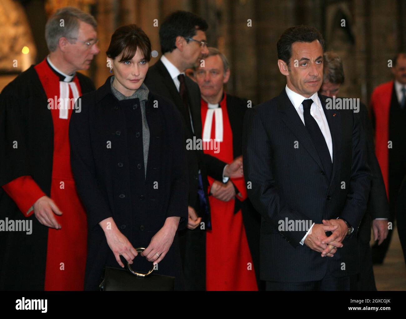 French President Nicolas Sarkozy stands with his wife Carla Bruni ...