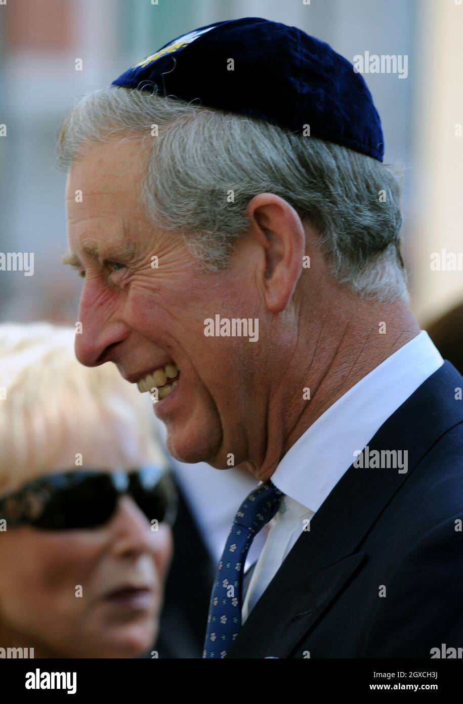 Prince Charles, Prince of Wales, wearing a Jewish yarmulka, smiles as ...