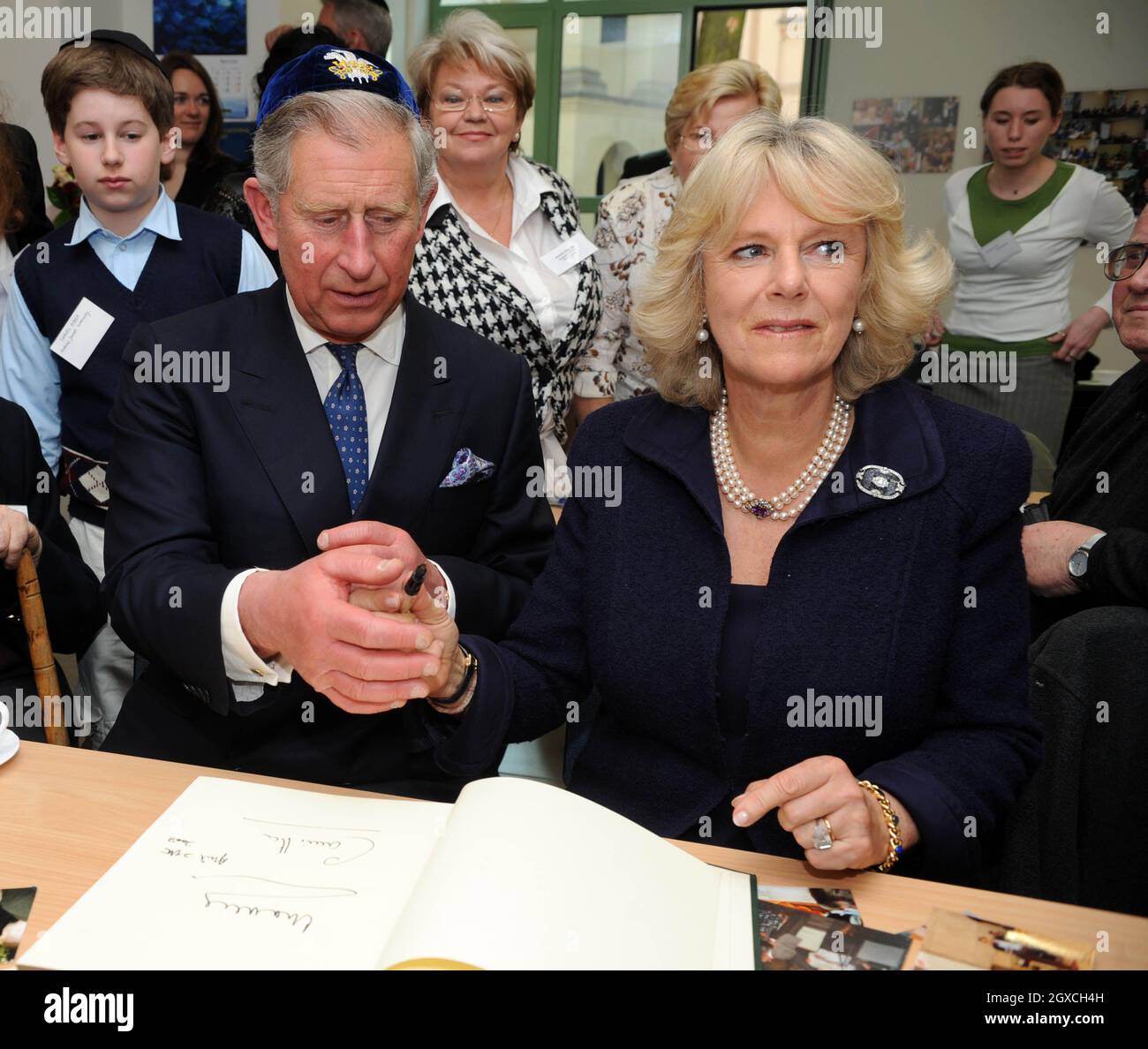 Prince Charles, Prince of Wales, wearing a Jewish yarmulka, and Camilla ...