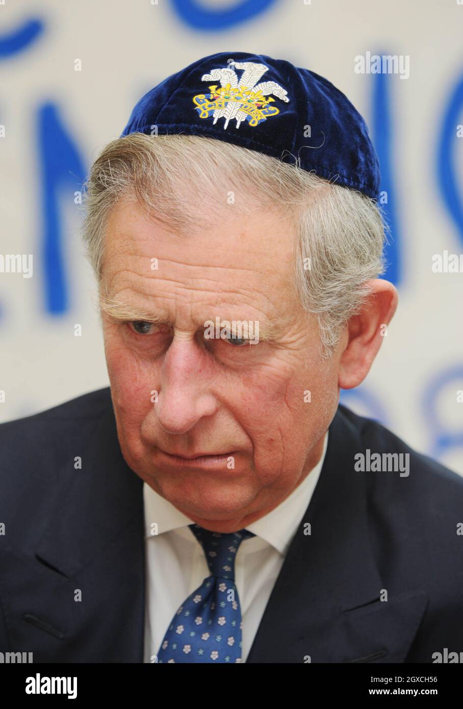 Prince Charles, Prince of Wales, wearing a Jewish yarmulka, attends the ...