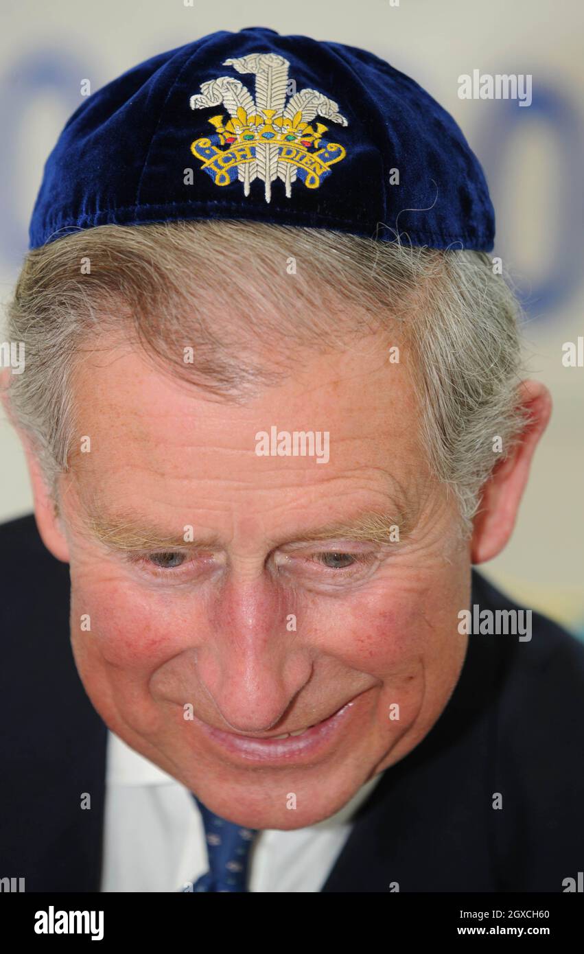 Prince Charles, Prince of Wales, wearing a Jewish yarmulka, attends the ...
