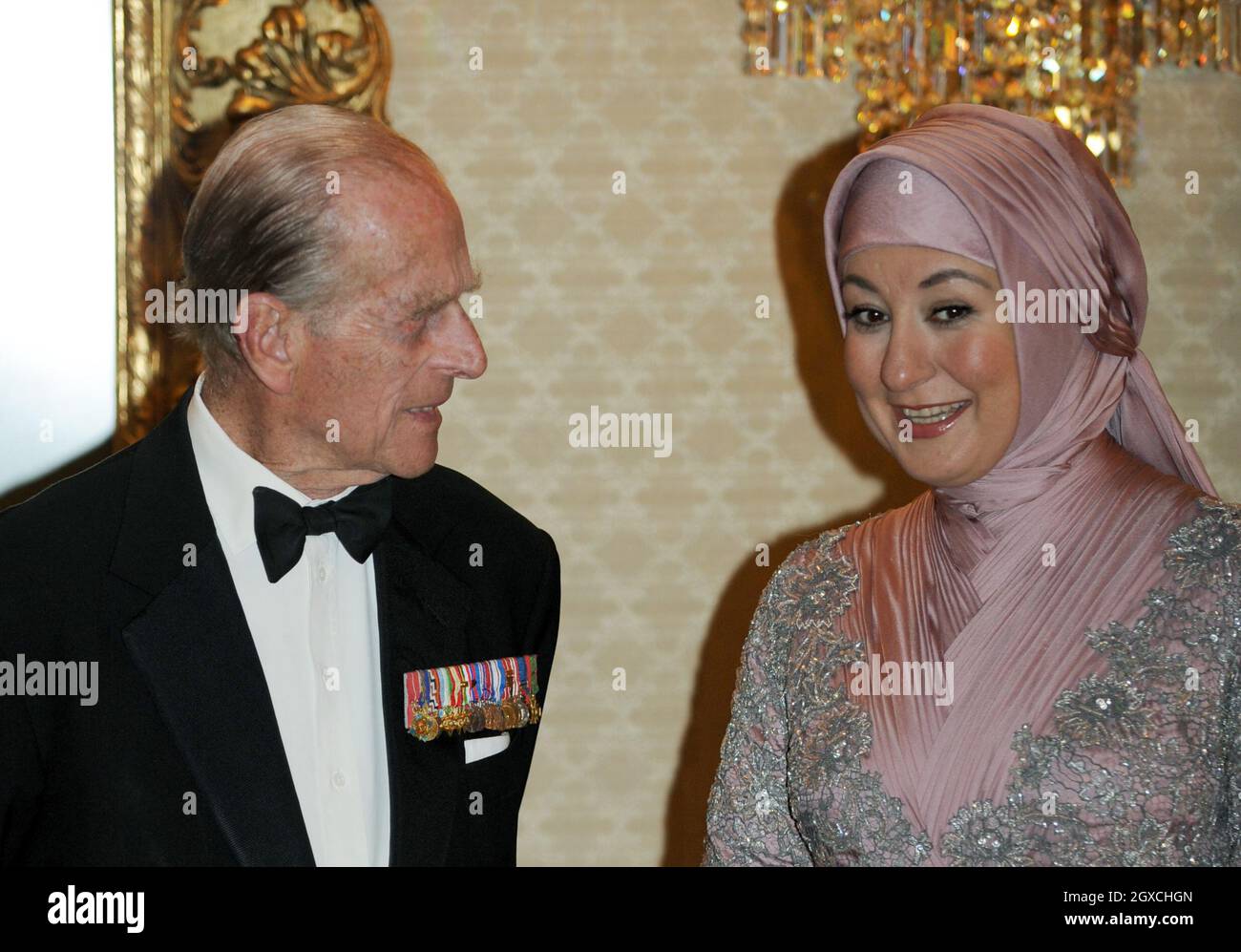 Prince Philip, Duke of Edinburgh looks at Hayrunnisa Gul, wife of ...