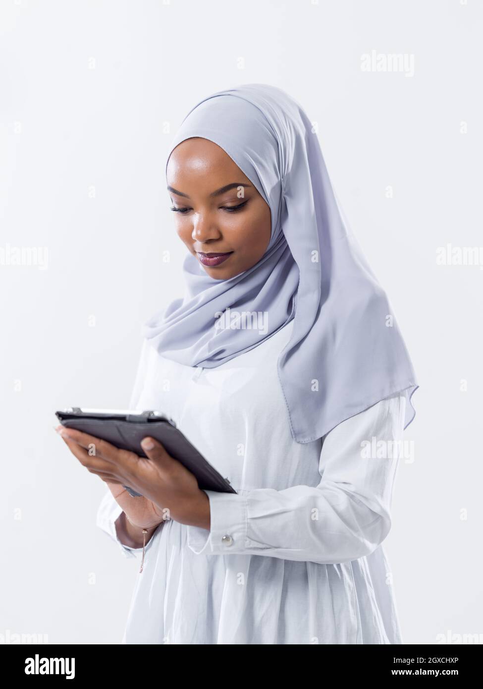 young modern muslim african business woman using tablet computer ...