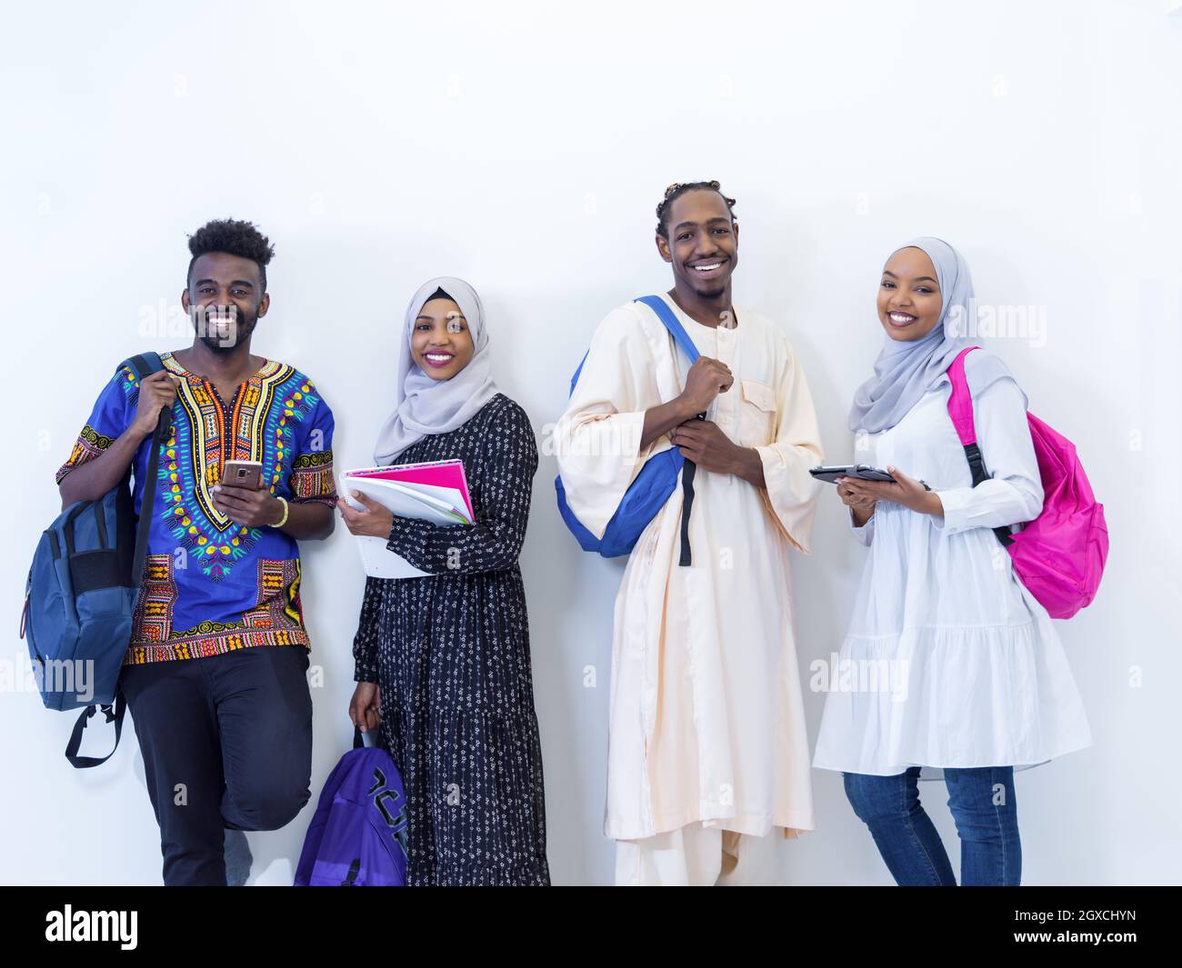 group portrait of happy african students standing together against ...