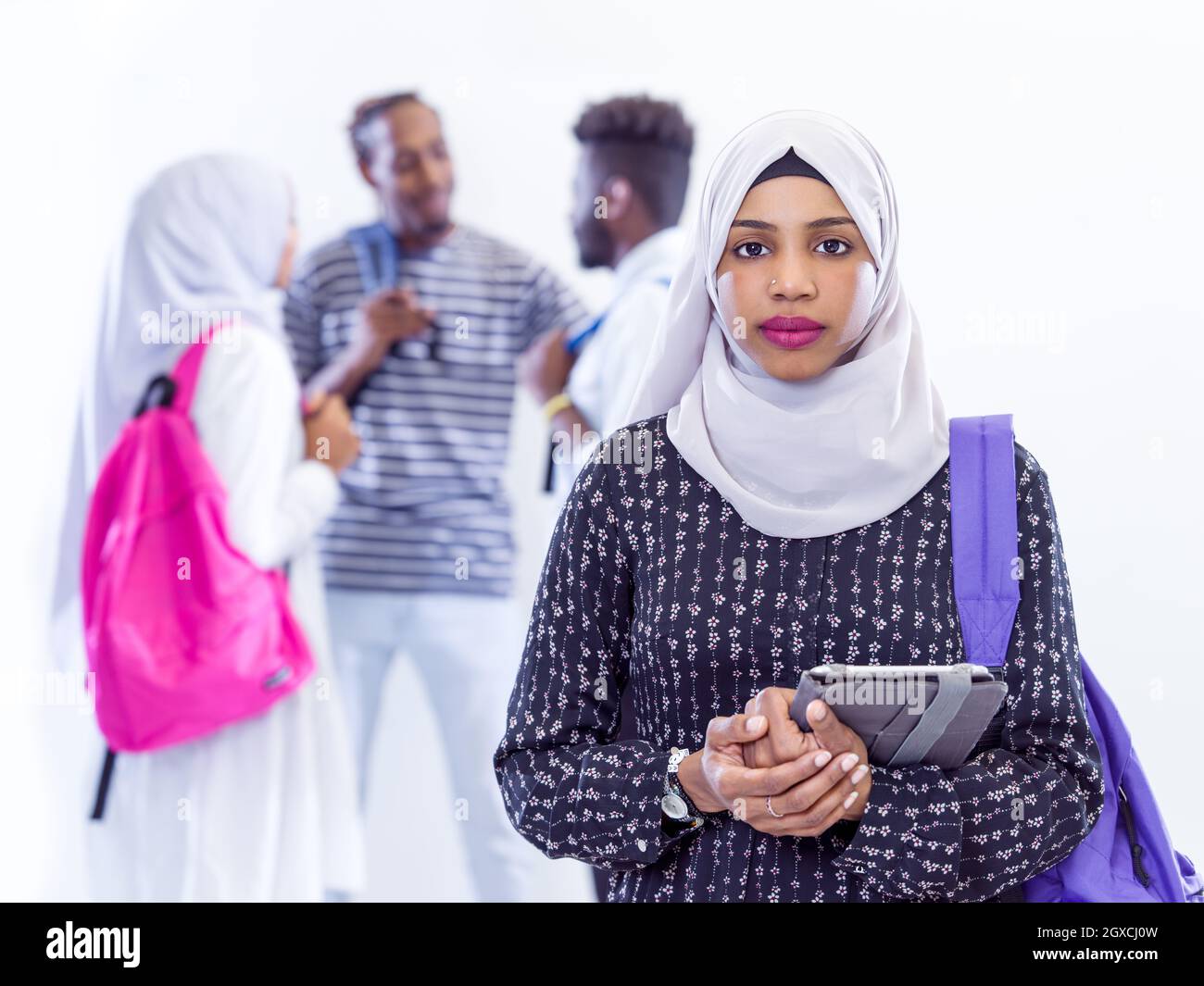 young african modern muslim female student using tablet computer with ...