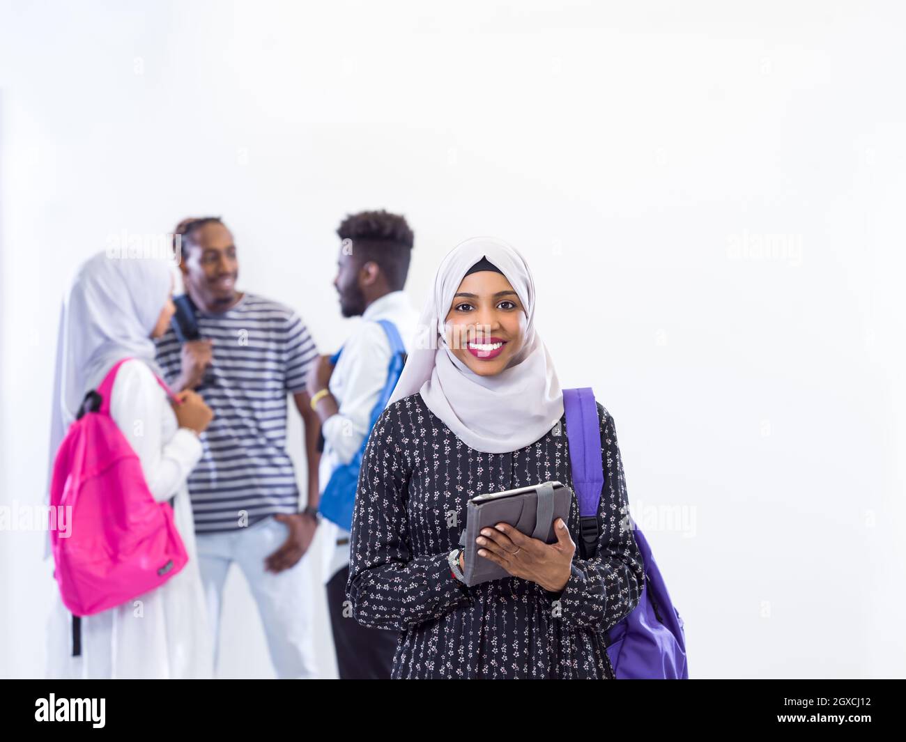 young african modern muslim female student using tablet computer with ...