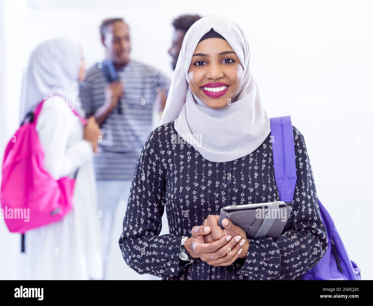young african modern muslim female student using tablet computer with ...